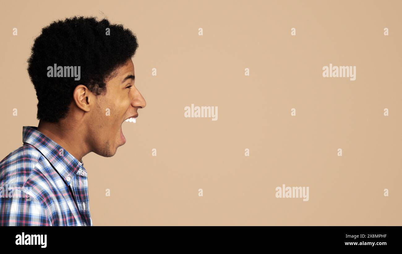 Profile portrait of screaming teen guy, white background Stock Photo ...