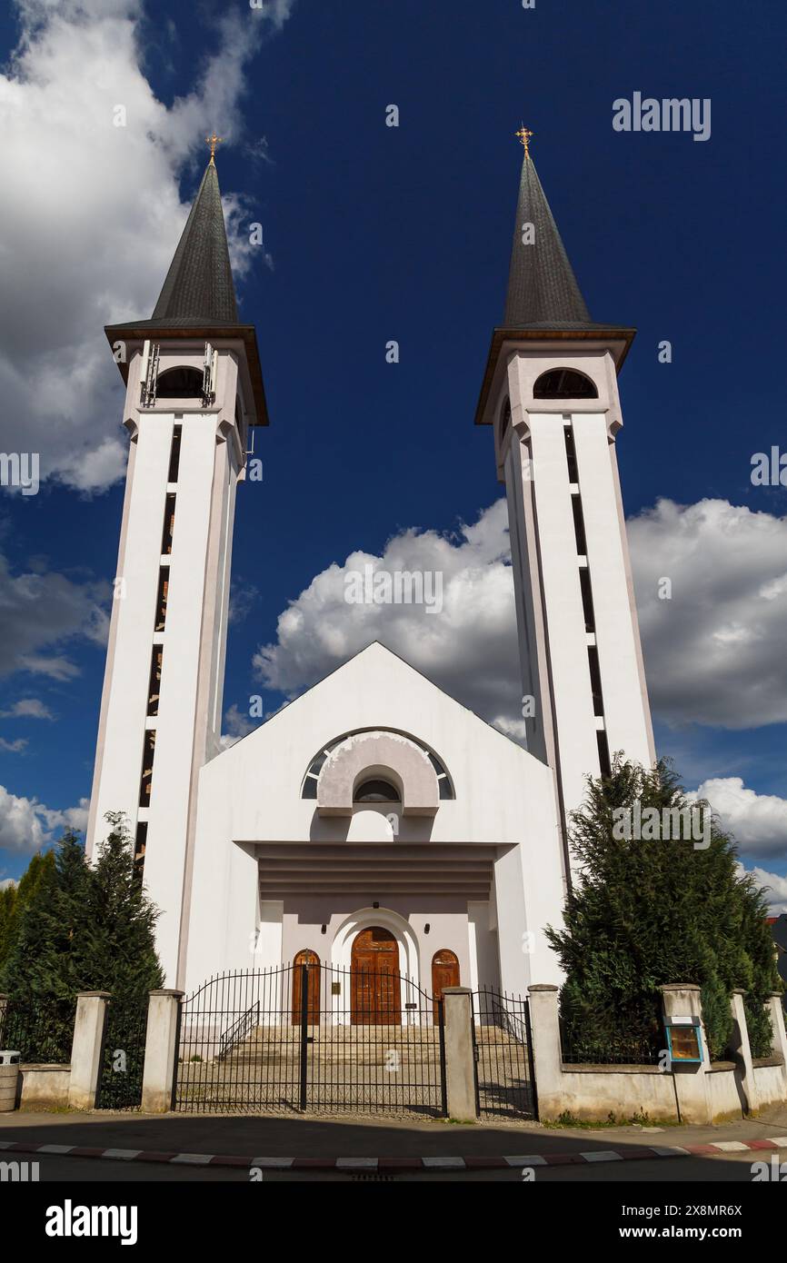 The Orthodox church in Avrig town against a blue sky with clouds ...