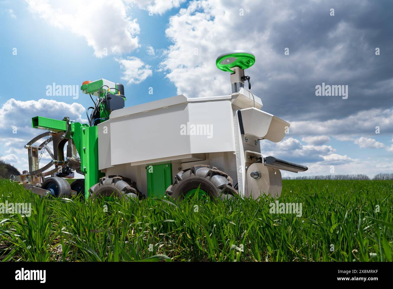 Autonomous wheeled robot is working in an agricultural field. Using ...