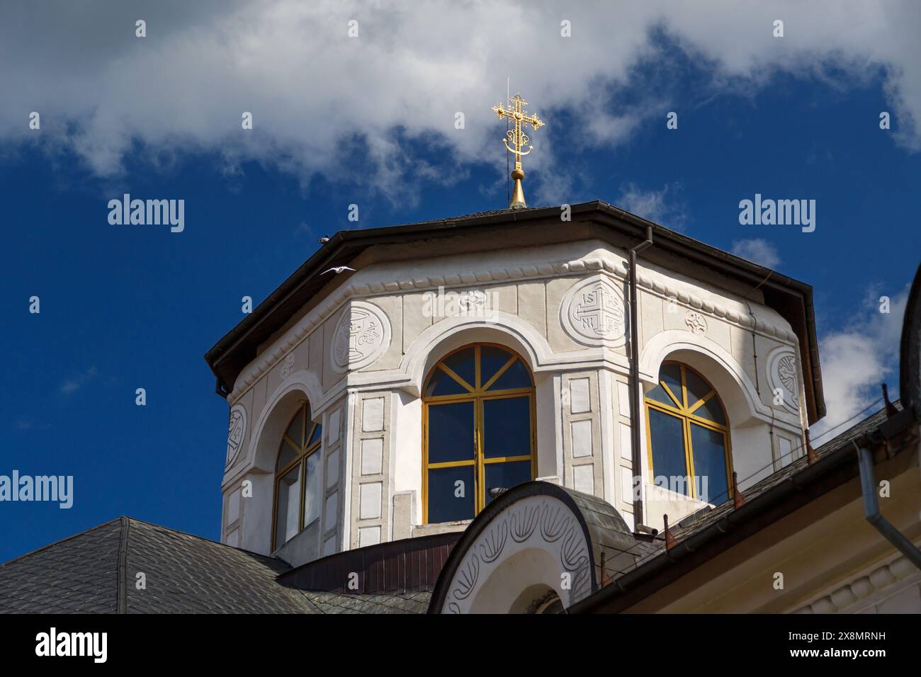 The Orthodox church in Avrig town against a blue sky with clouds ...
