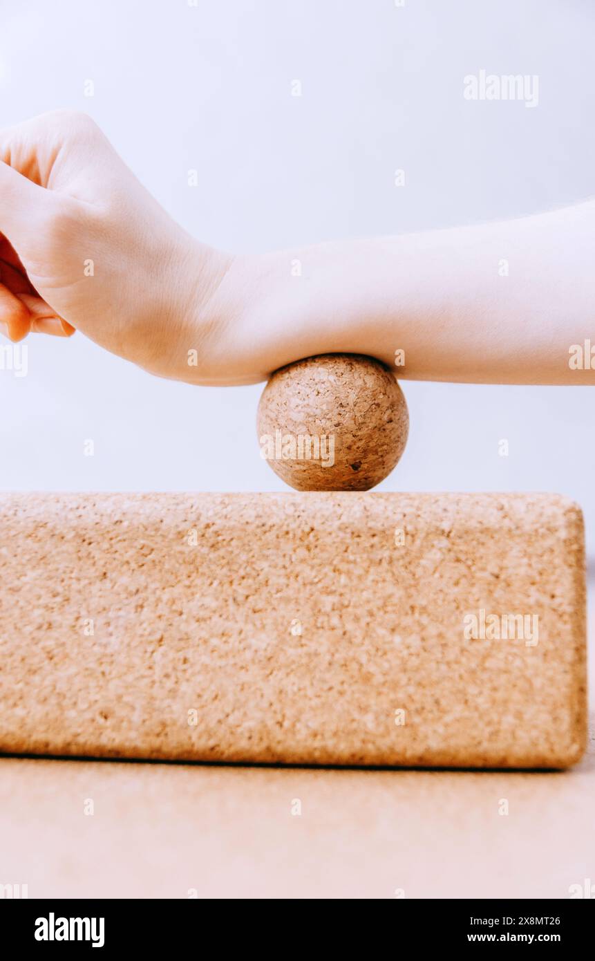 Close up forearm myofascial release practice with massage ball on cork ...