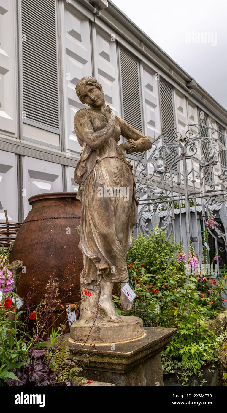 Ornate statue in a show garden at the 2024 RHS Chelsea flower show ...