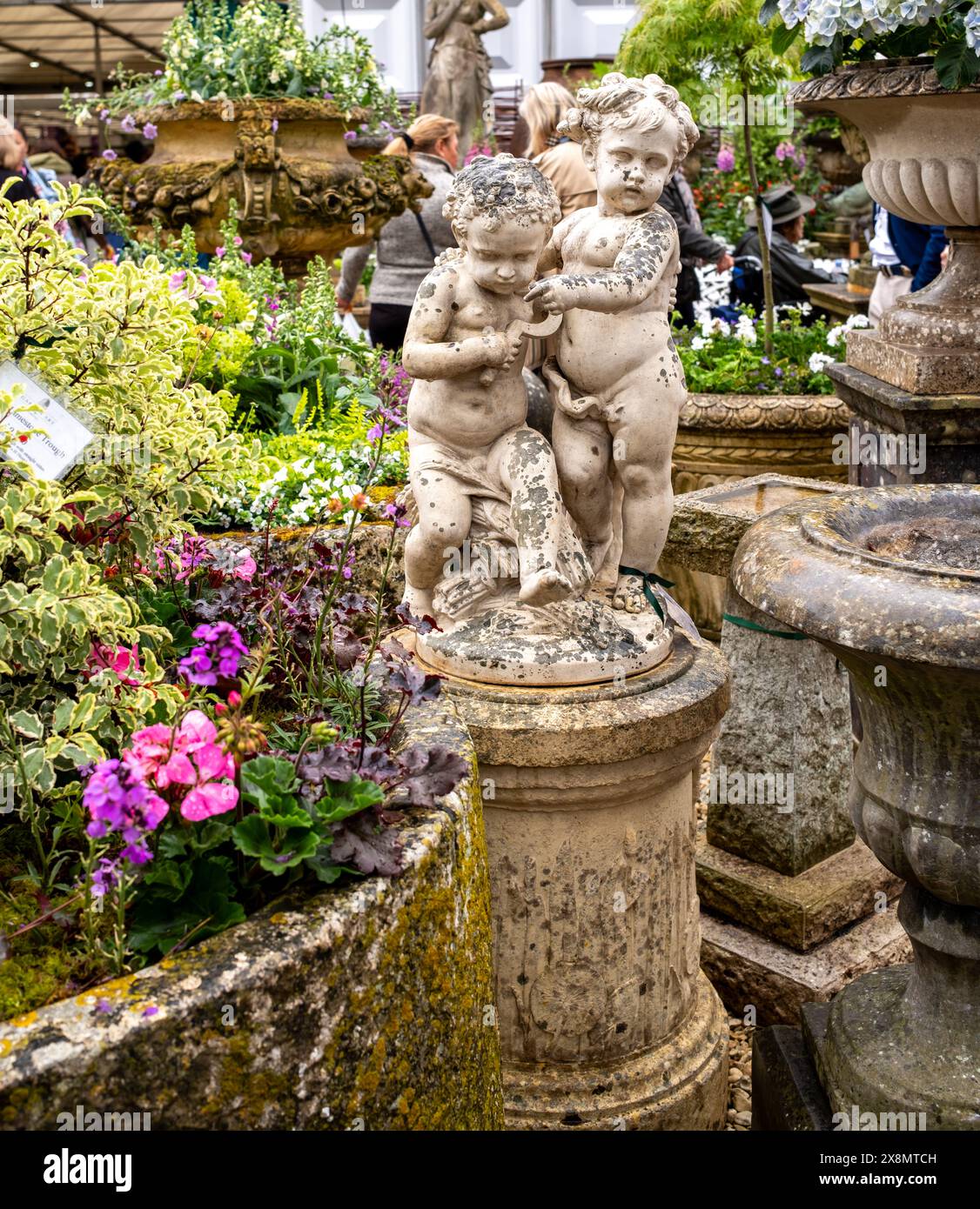 Ornate statues on a display in a show garden at the 2024 RHS Chelsea ...