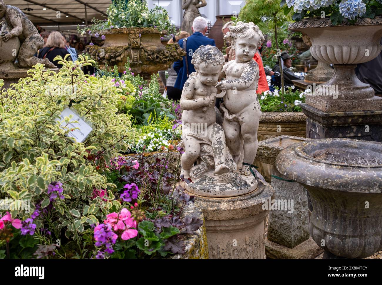 Ornate statues on a display in a show garden at the 2024 RHS Chelsea ...
