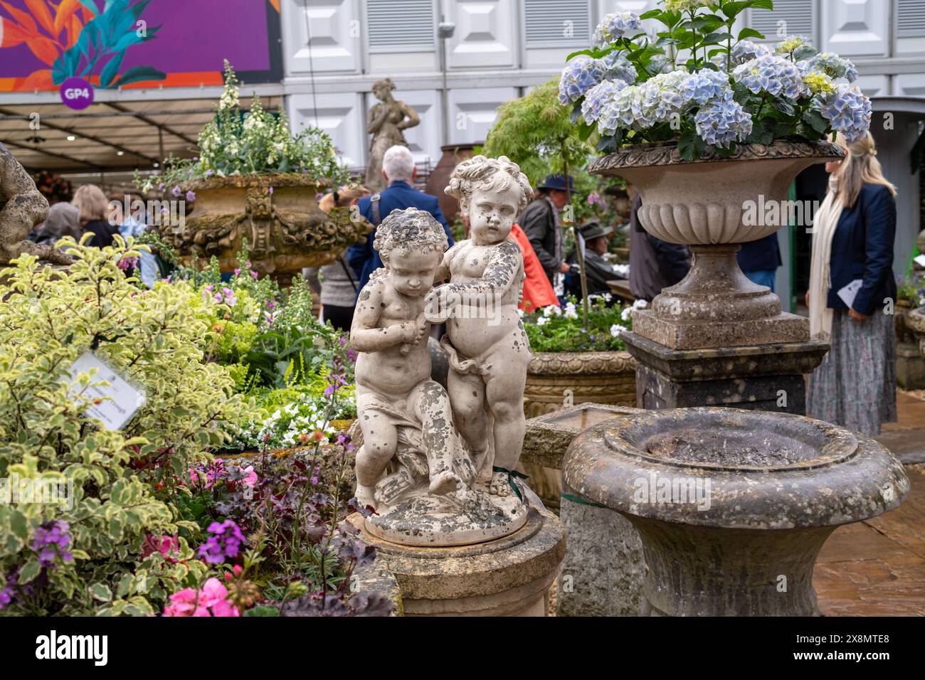 Ornate statues on a display in a show garden at the 2024 RHS Chelsea ...