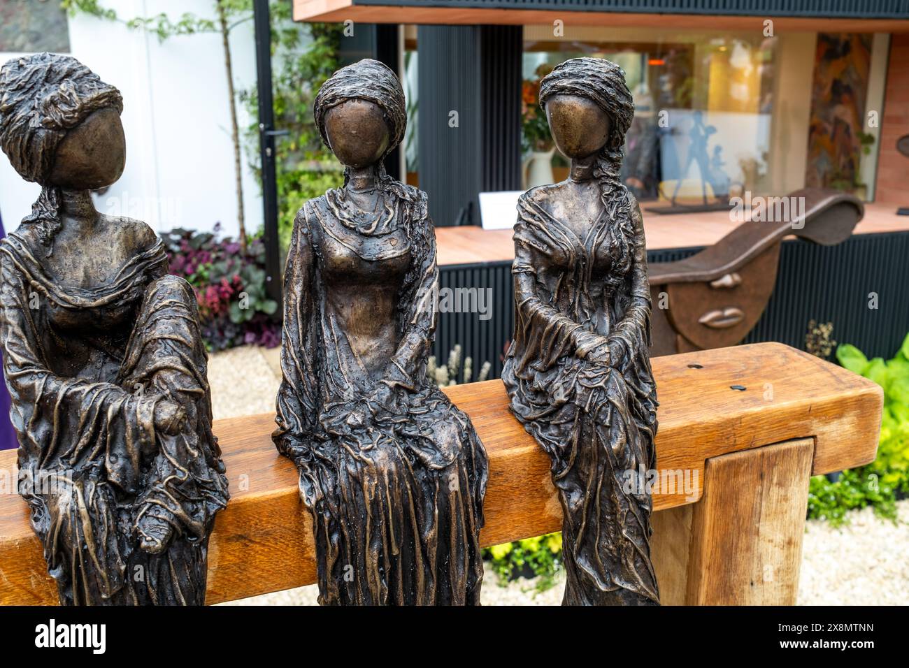 Three bronze lady statuettes on display and for sale at the 2024 RHS ...
