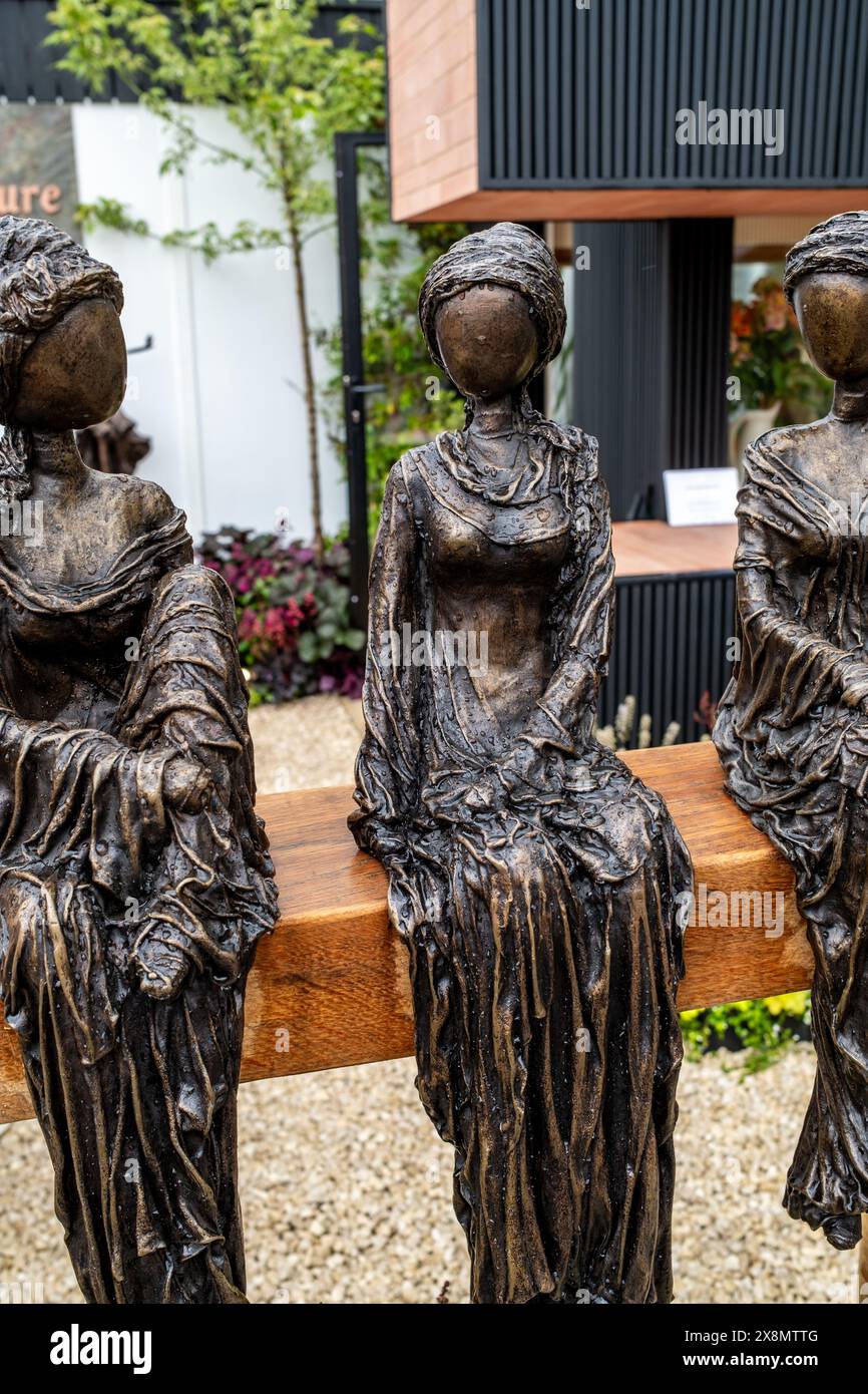 Three bronze lady statuettes on display and for sale at the 2024 RHS ...