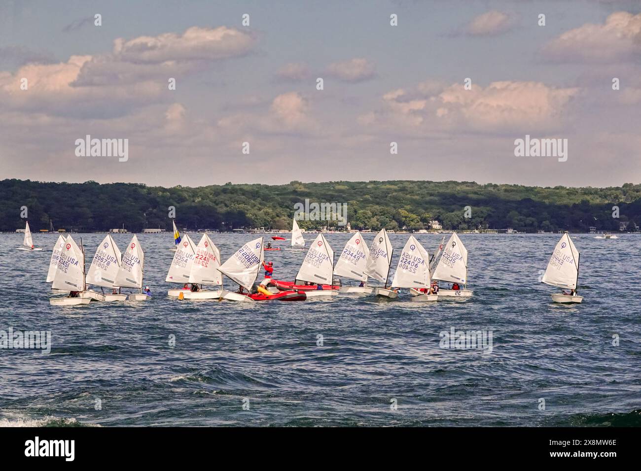 Sailing dinghies compete on Lake Geneva, Wisconsin. Lake Geneva is a ...