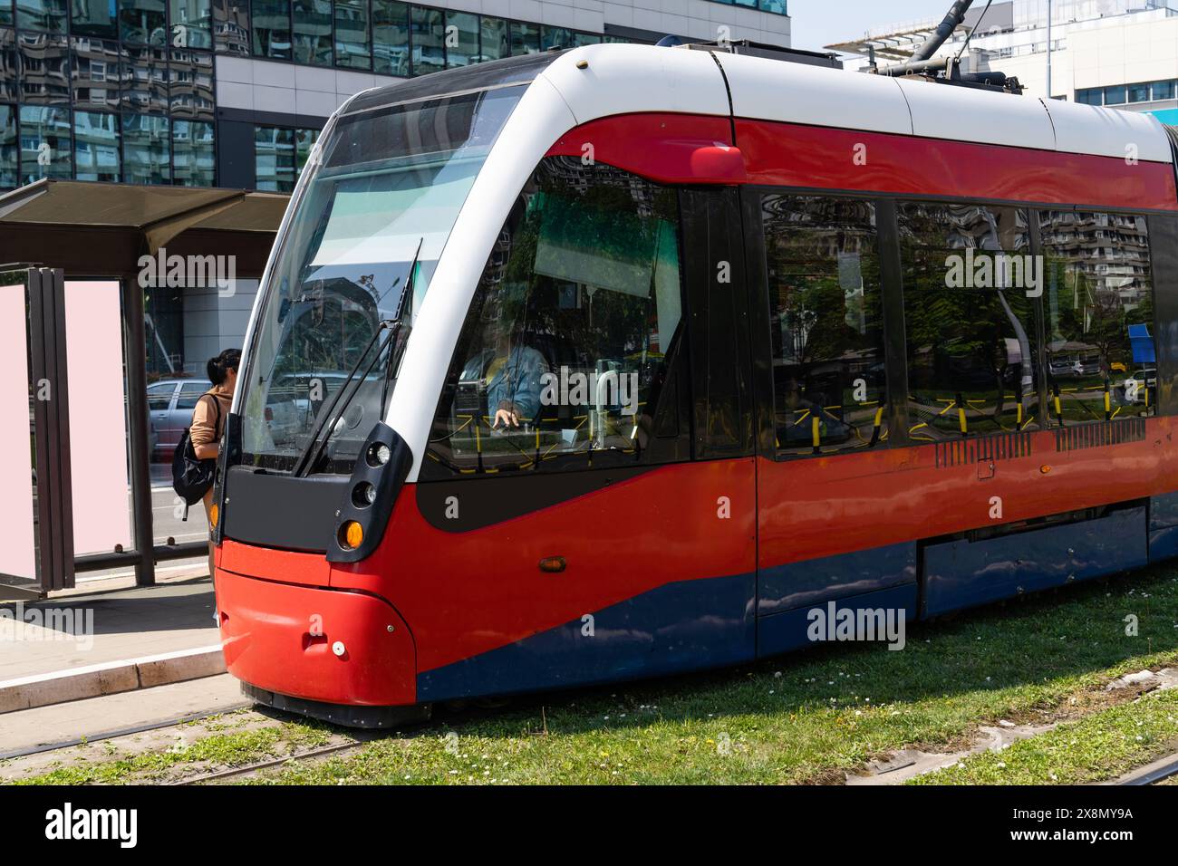 Modern red tram on hi-res stock photography and images - Alamy