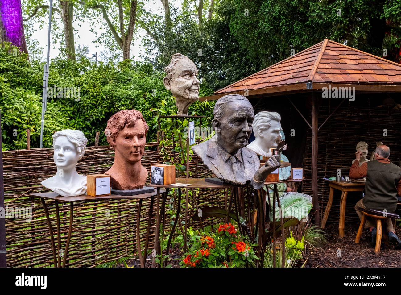 Bronze sculpture heads on display at a trade fair Stock Photo - Alamy