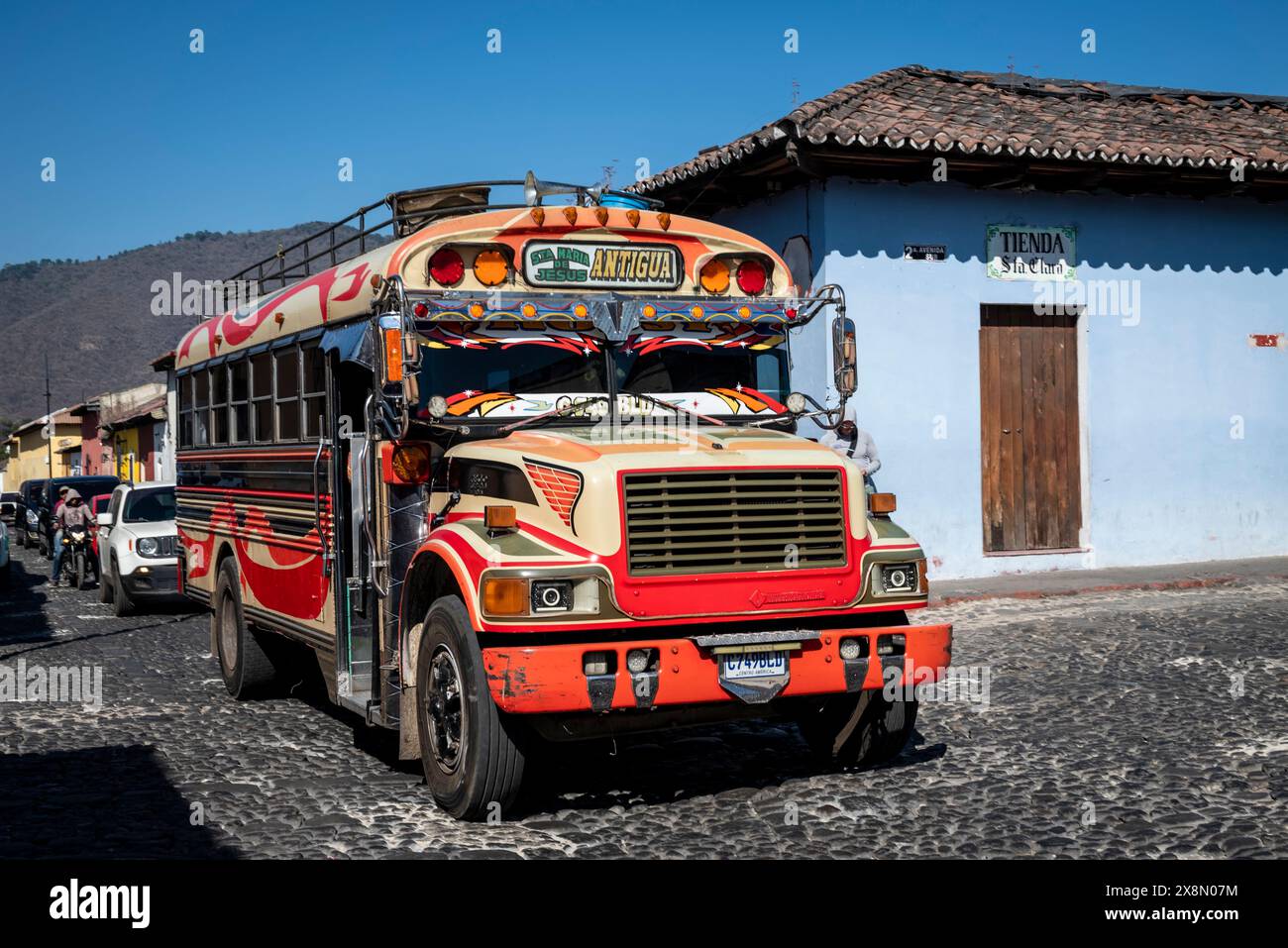 Colourful chicken bus in the Spanish colonial-era city centre, Antigua ...