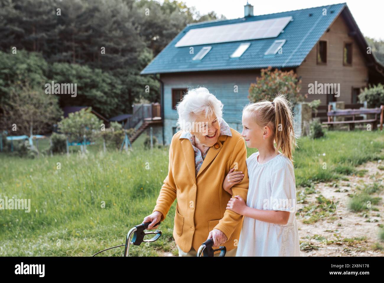 Granddaughter spending time with elderly grandma, companionship. Senior ...