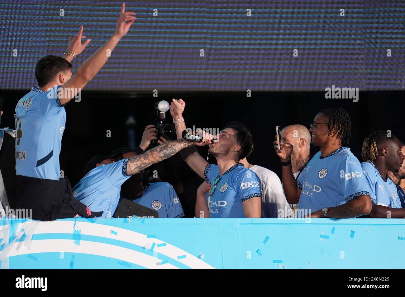 Manchester City's Jack Grealish (centre) celebrates during a trophy ...