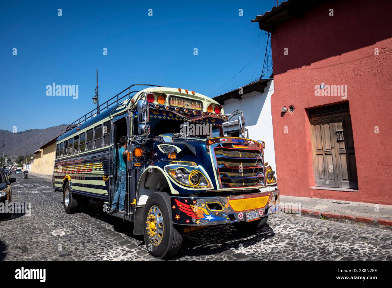 Colourful chicken bus in the Spanish colonial-era city centre, Antigua ...