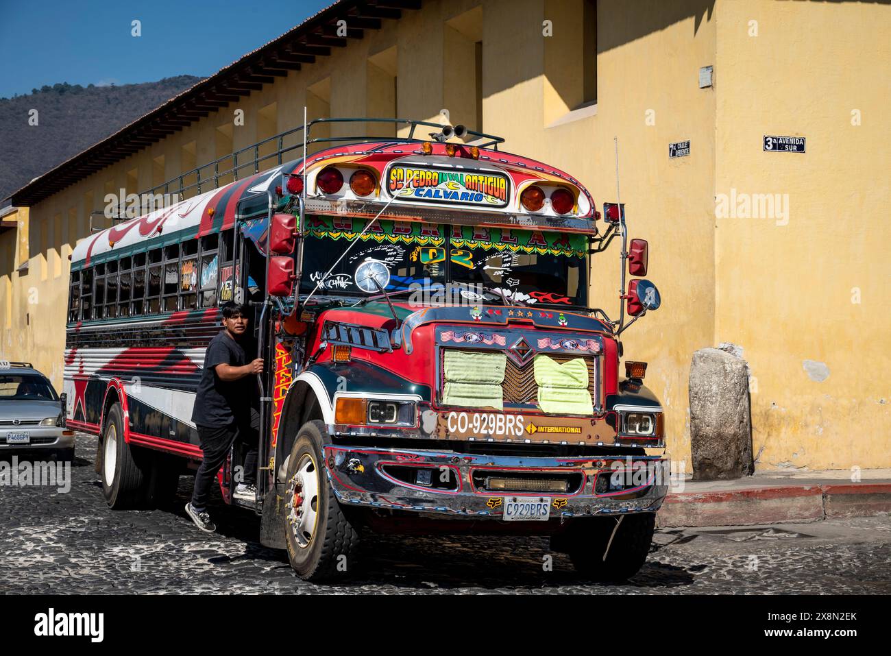 Colourful chicken bus in the Spanish colonial-era city centre, Antigua ...