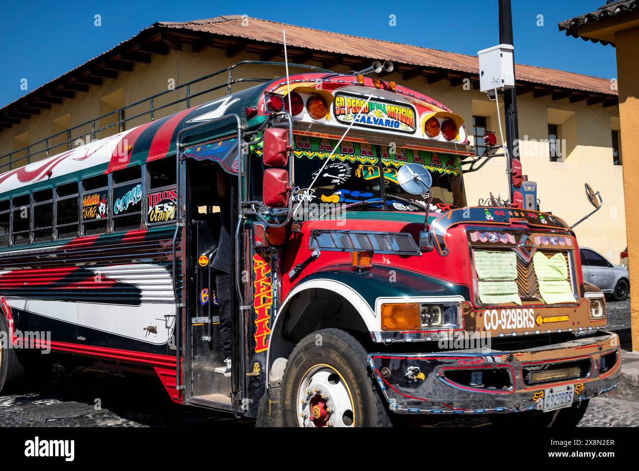 Colourful chicken bus in the Spanish colonial-era city centre, Antigua ...