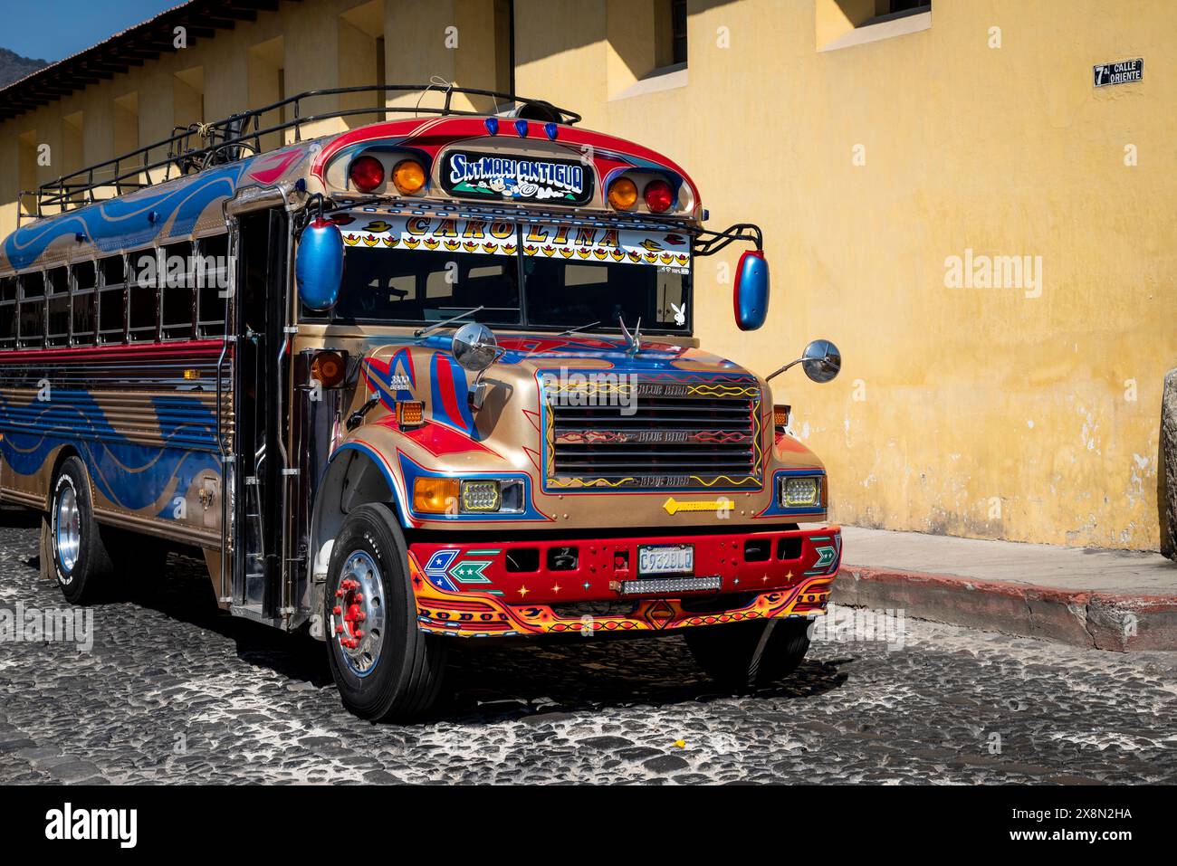 Colourful chicken bus in the Spanish colonial-era city centre, Antigua ...