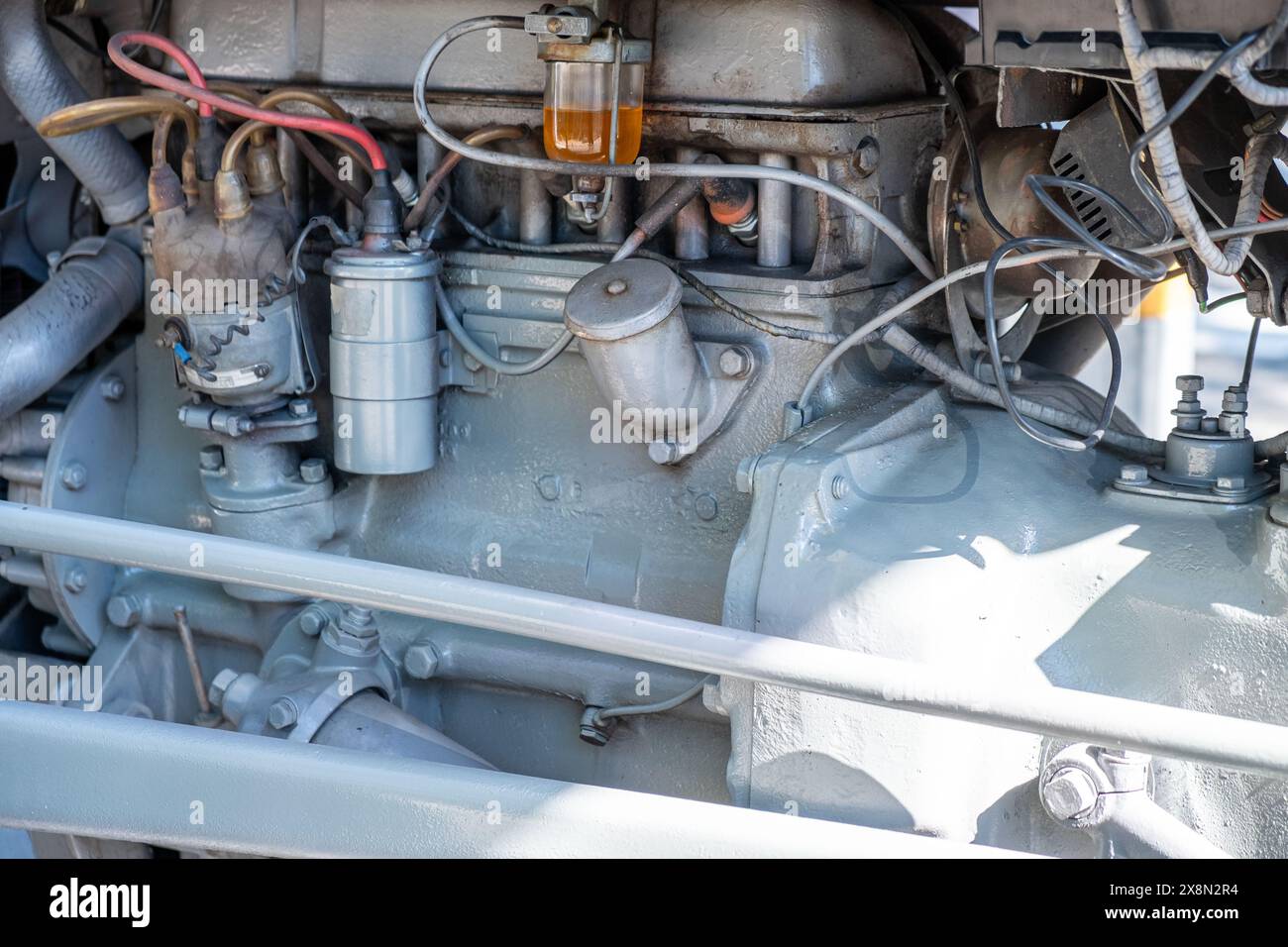 partial view of the engine of an old restored tractor, agricultural ...