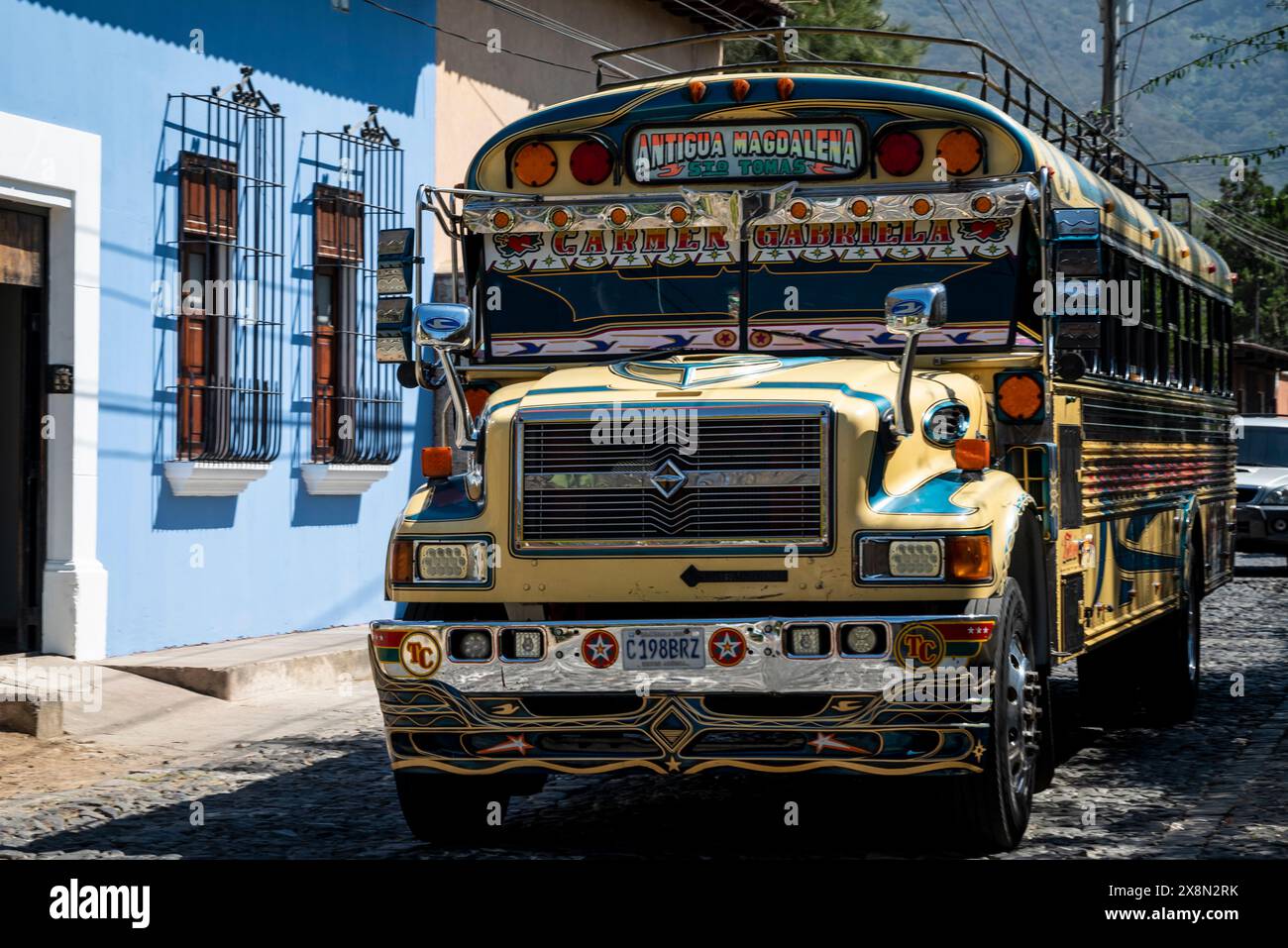 Colourful chicken bus in the Spanish colonial-era city centre, Antigua ...