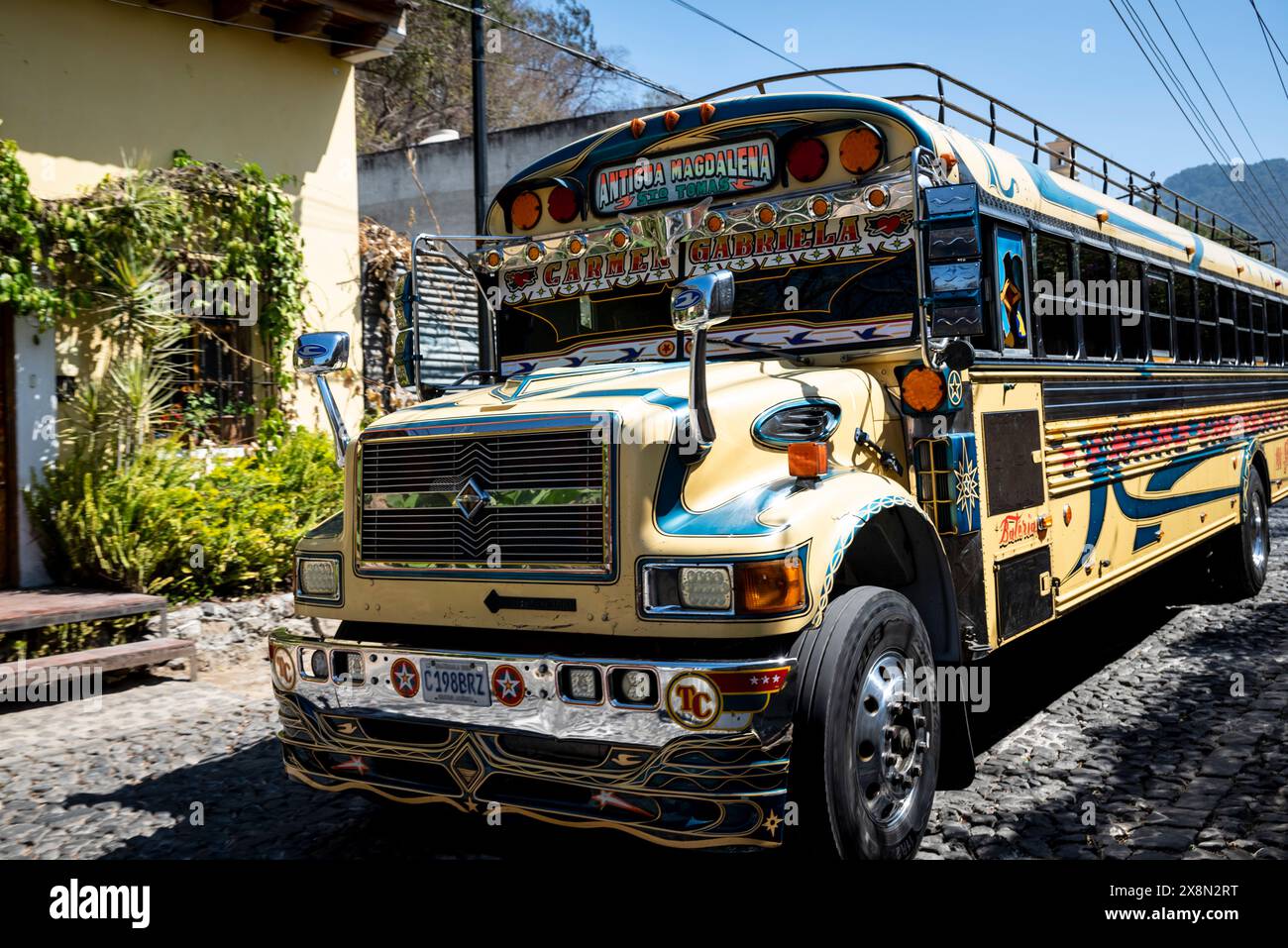 Colourful chicken bus in the Spanish colonial-era city centre, Antigua ...