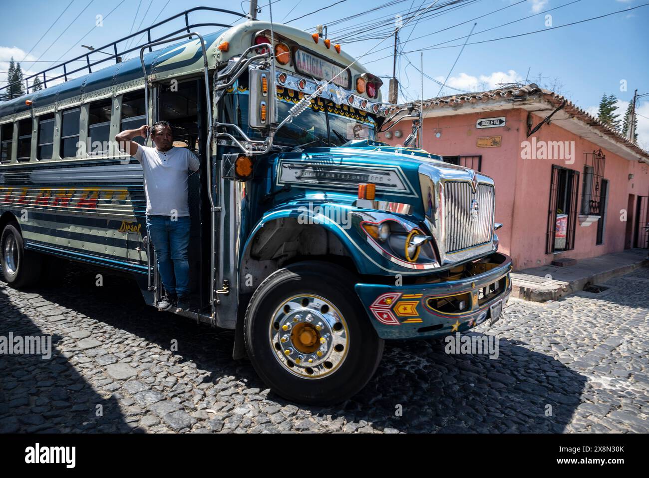 Colourful chicken bus in the Spanish colonial-era city centre, Antigua ...