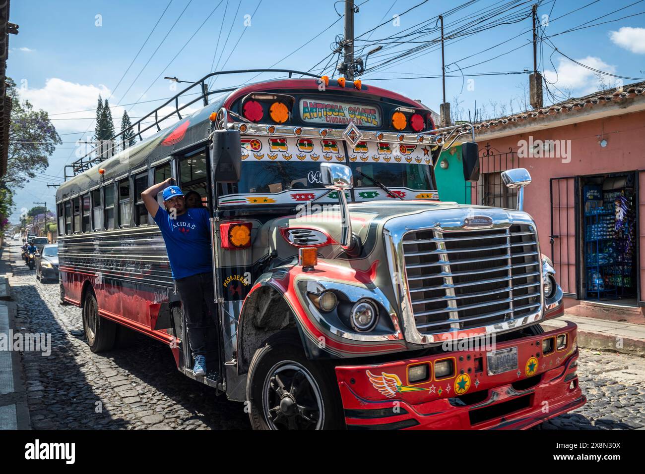 Colourful chicken bus in the Spanish colonial-era city centre, Antigua ...