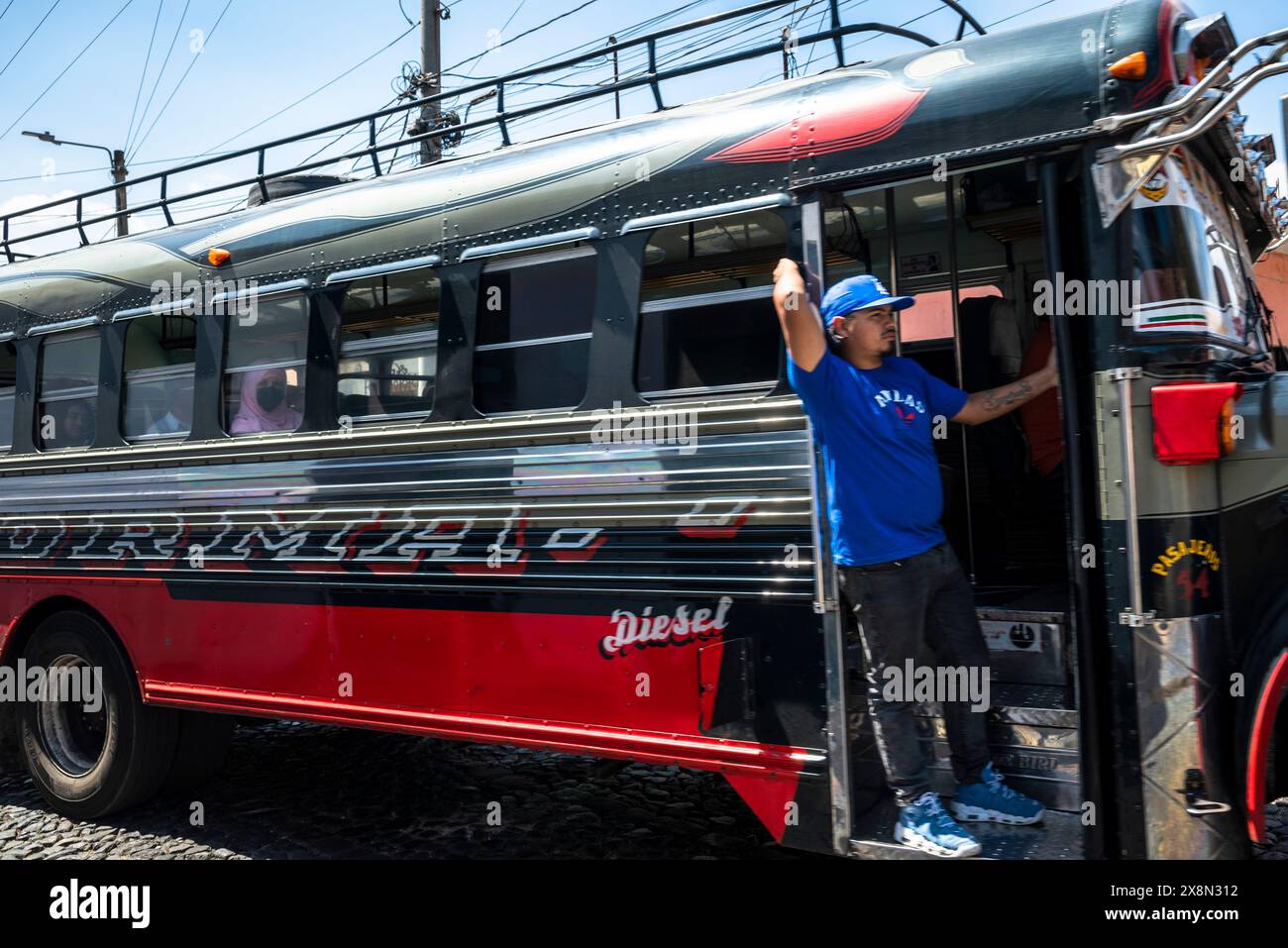 Colourful chicken bus in the Spanish colonial-era city centre, Antigua ...
