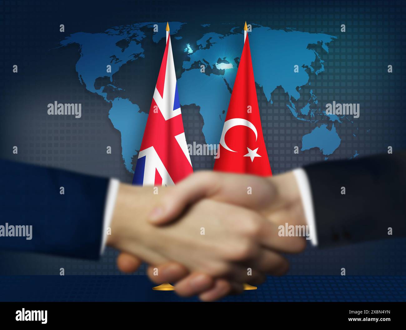 Two people shaking hands in front of Turkey and UK flags Stock Photo ...