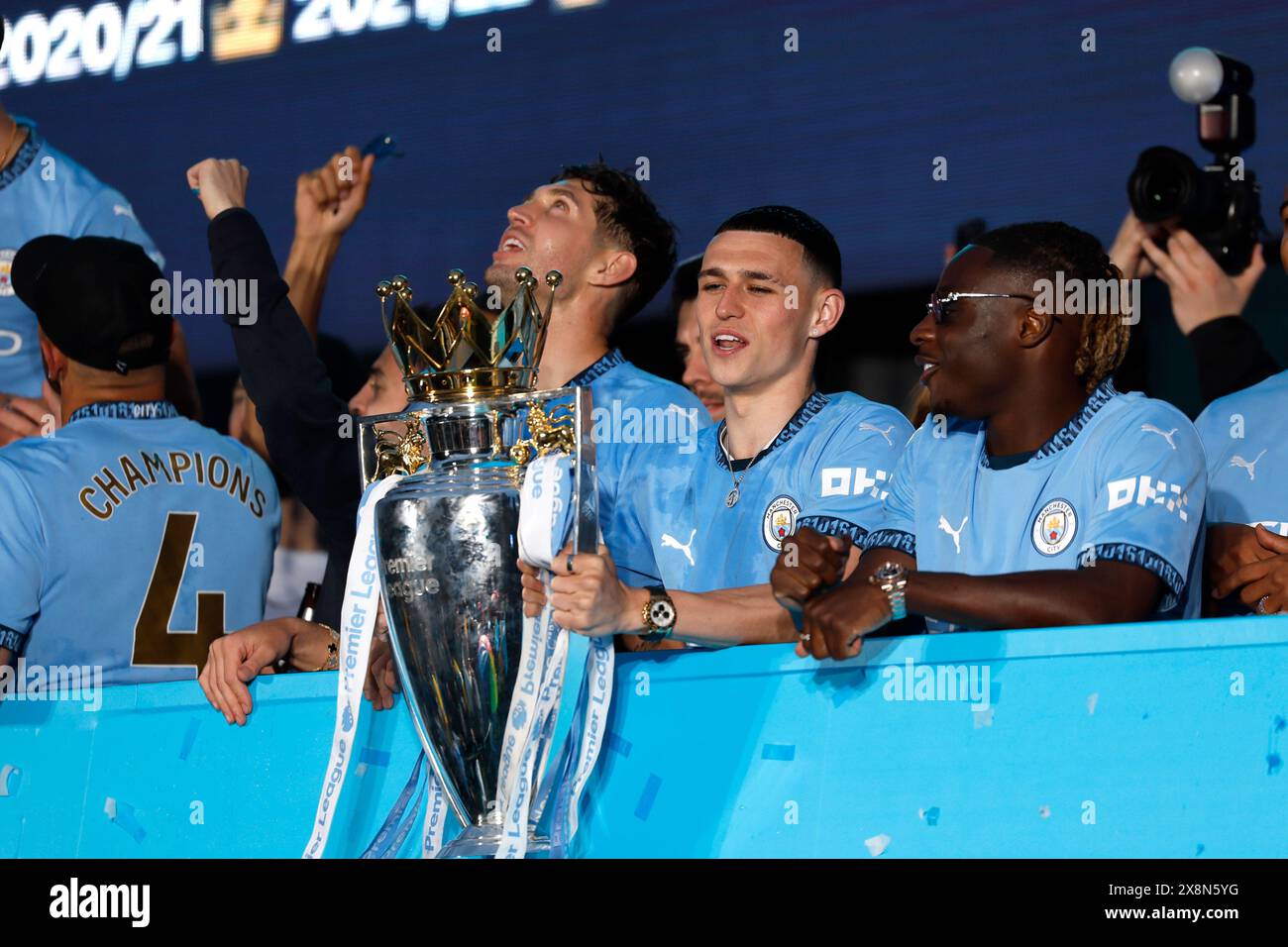 Phil Foden lifts the Premier League trophy during a trophy parade in ...