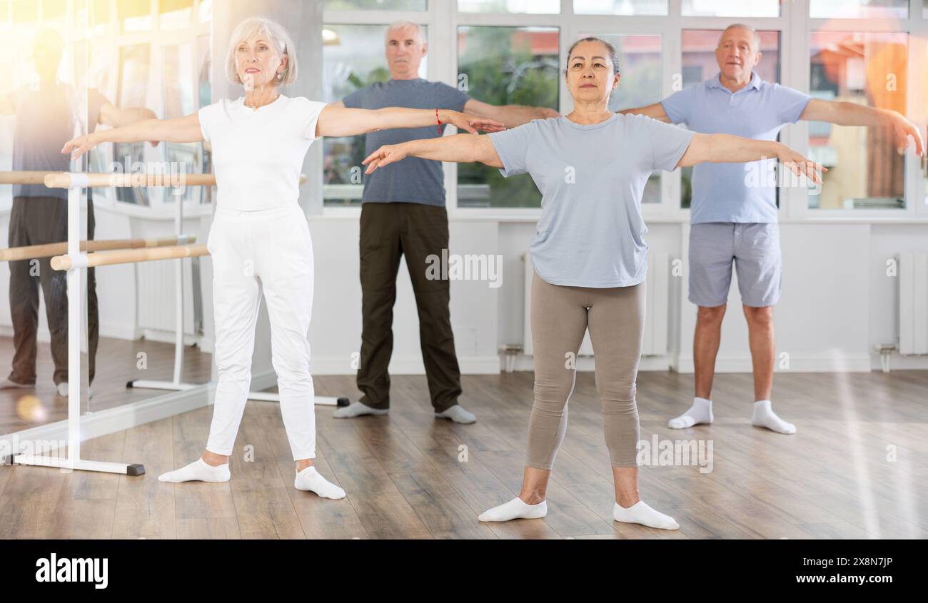 Group of elderly people of different ages are learning various dance ...