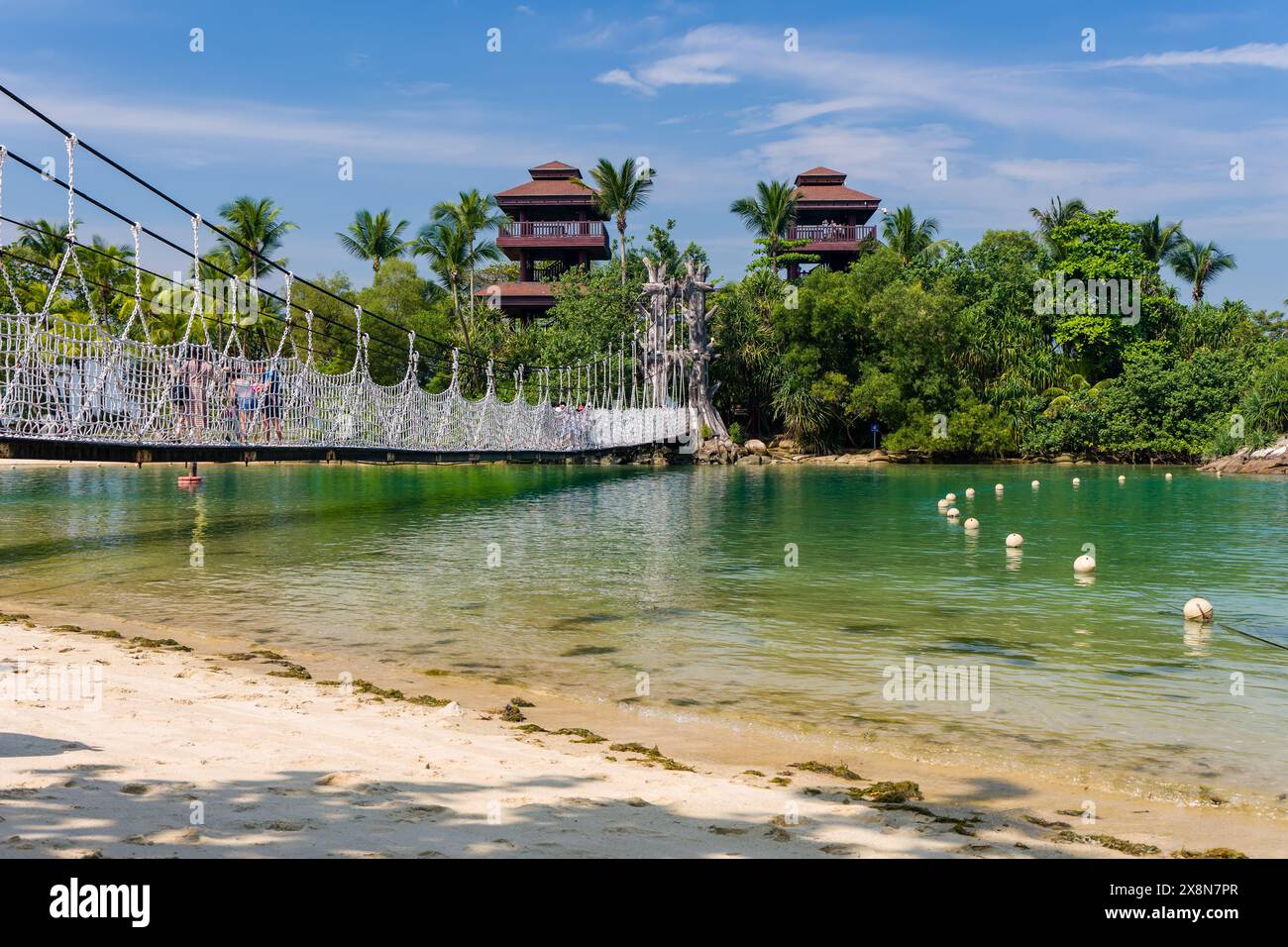 SINGAPORE - APRIL 08 2024: Golden sand and lush vegetation on the ...