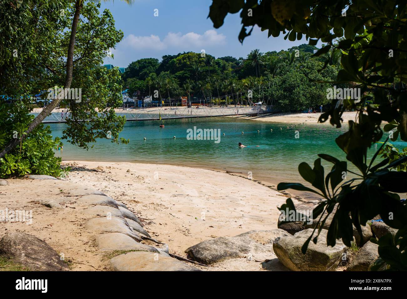 SINGAPORE - APRIL 08 2024: Golden sand and lush vegetation on the ...