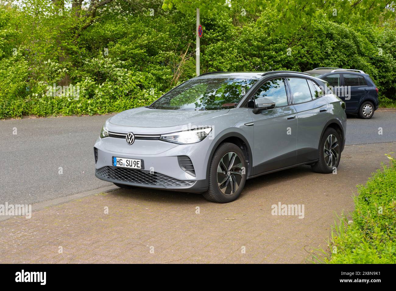 electric light blue car Volkswagen ID.4 on street, technology German ...