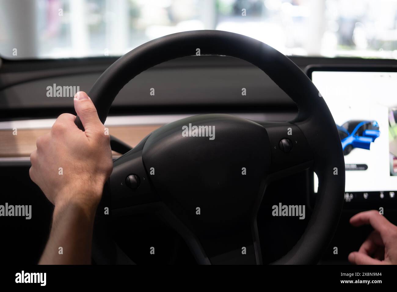 cockpit, male hand on Driver's column, Behind steering wheel electric ...