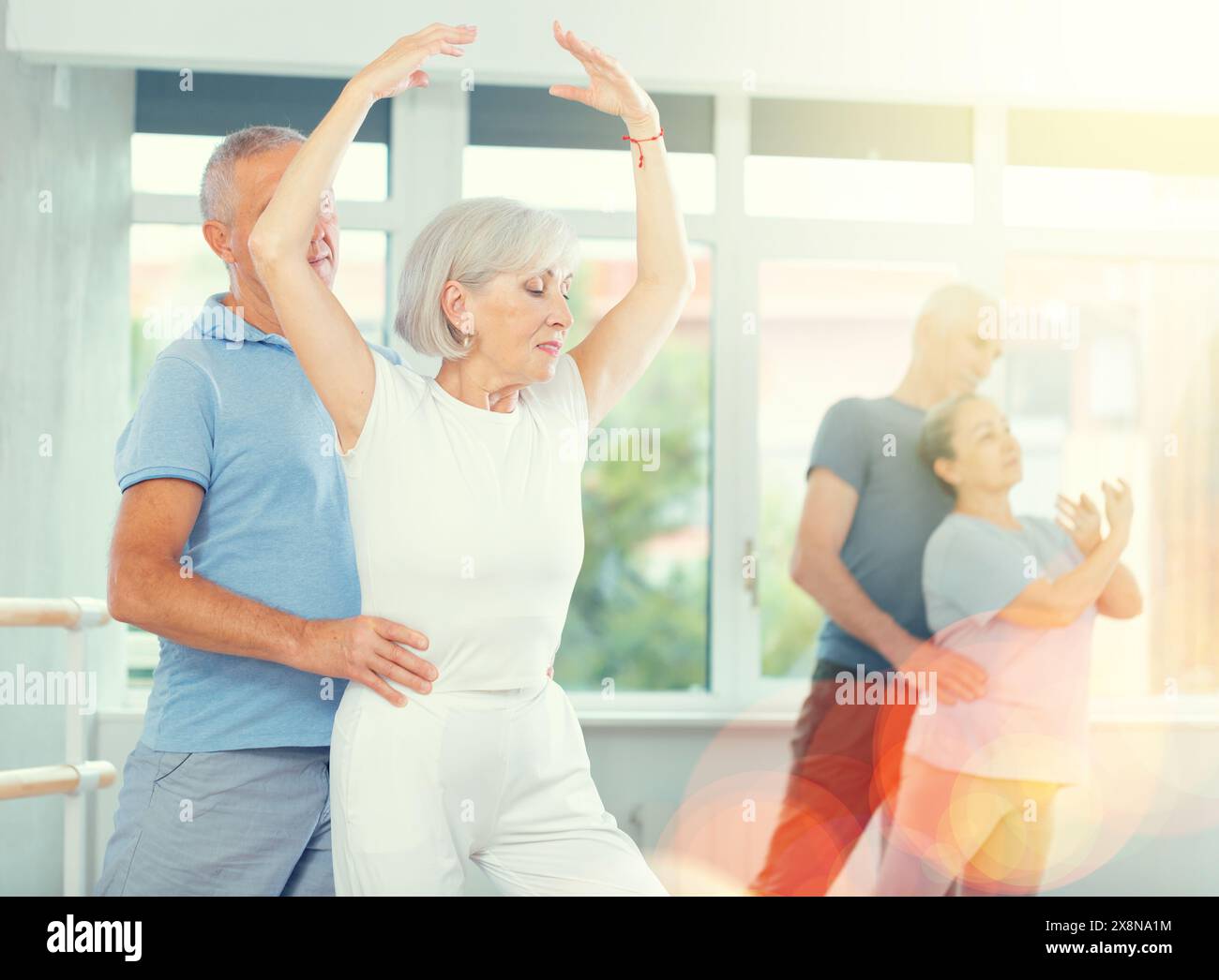 Contemporary mature ballet dancers couple performing graceful ...