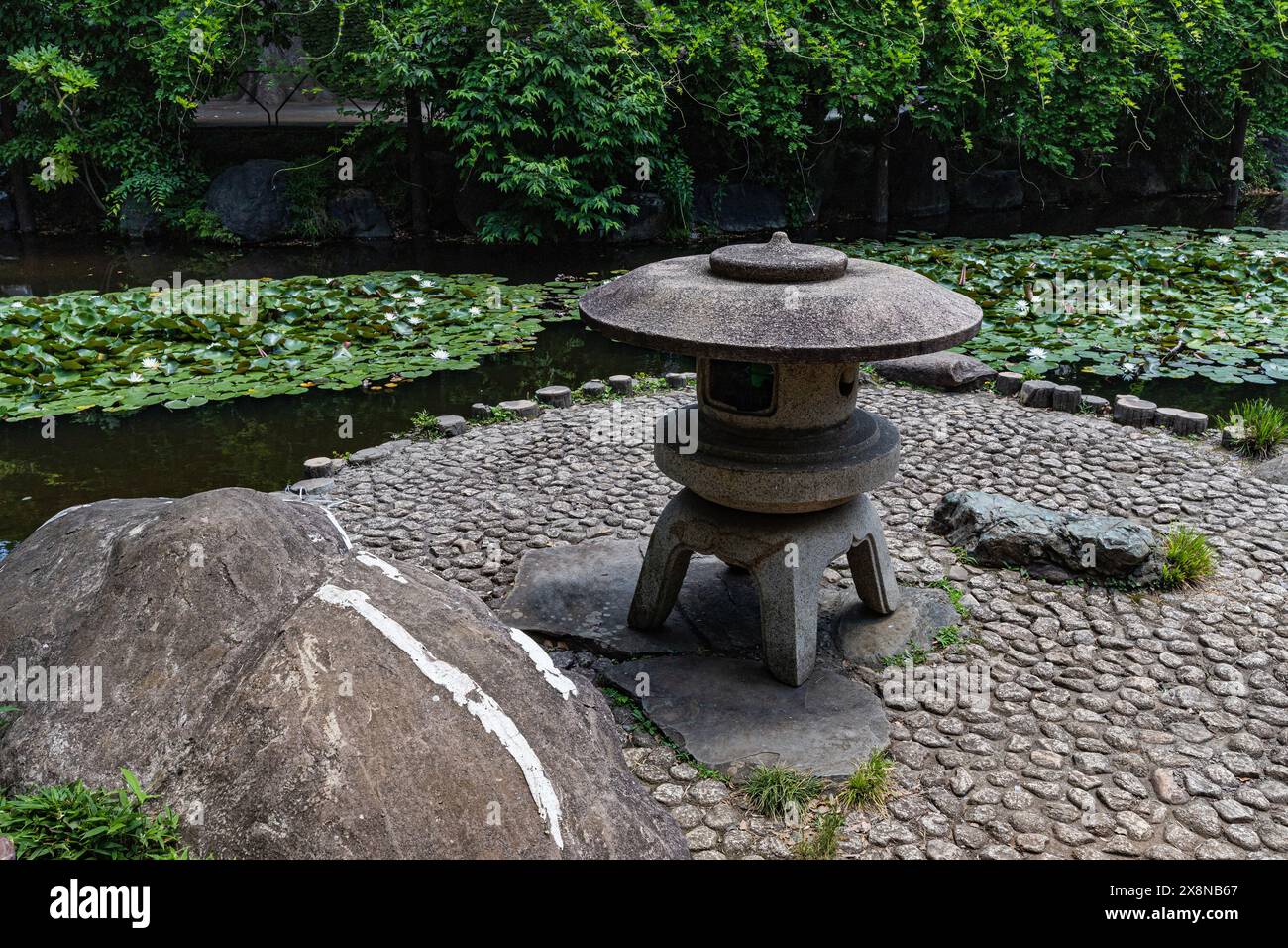 Sudo Park rises like an amphitheater around a central pond and shrine ...