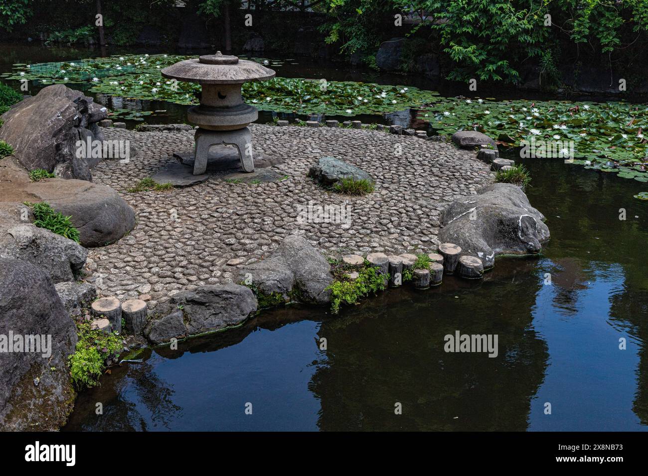 Sudo Park rises like an amphitheater around a central pond and shrine ...