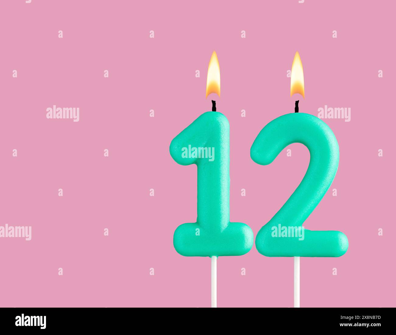 Green candle number 12 - Birthday card on pastel pink background Stock ...