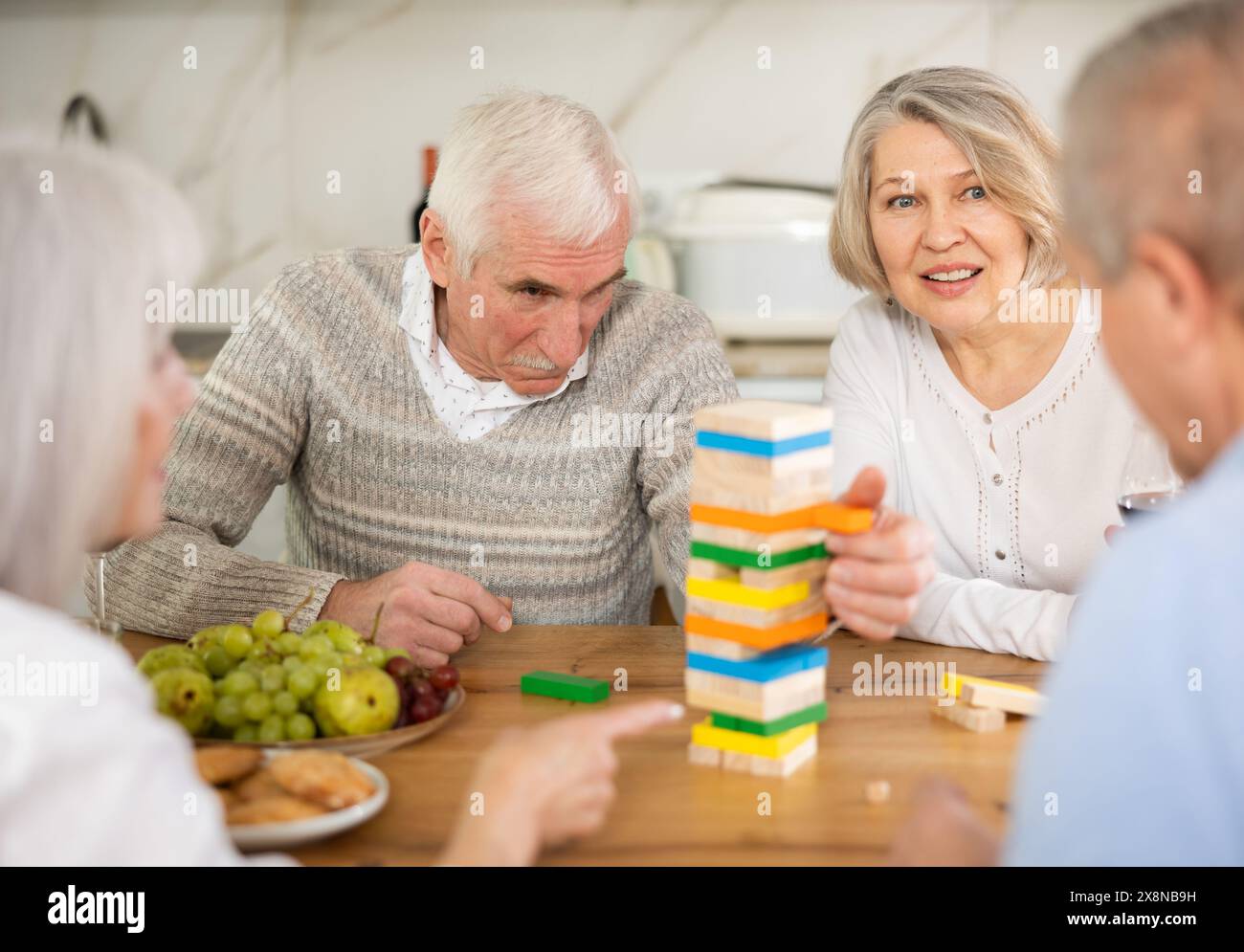 Group friends playing jenga game hi-res stock photography and images ...