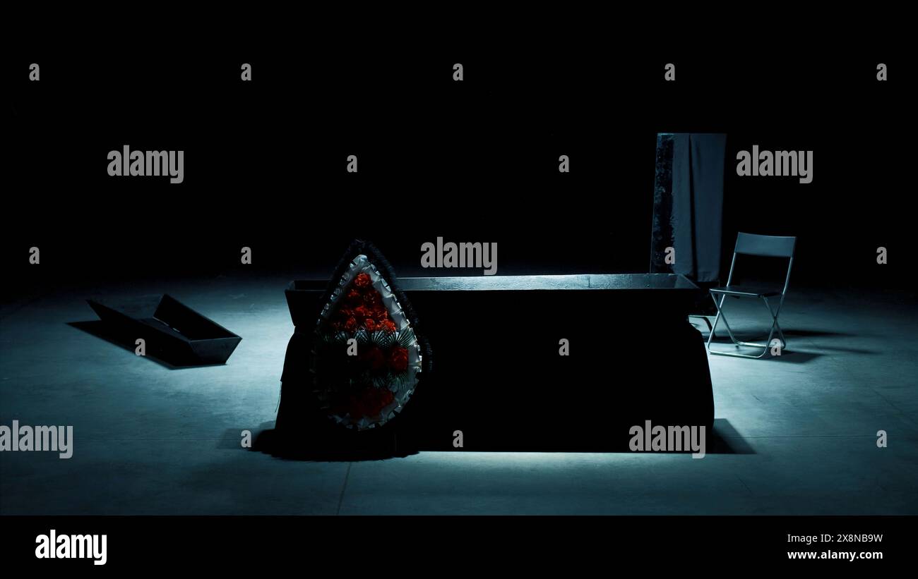 Coffin on stage. Stock footage. Dark scene with empty coffin and ...