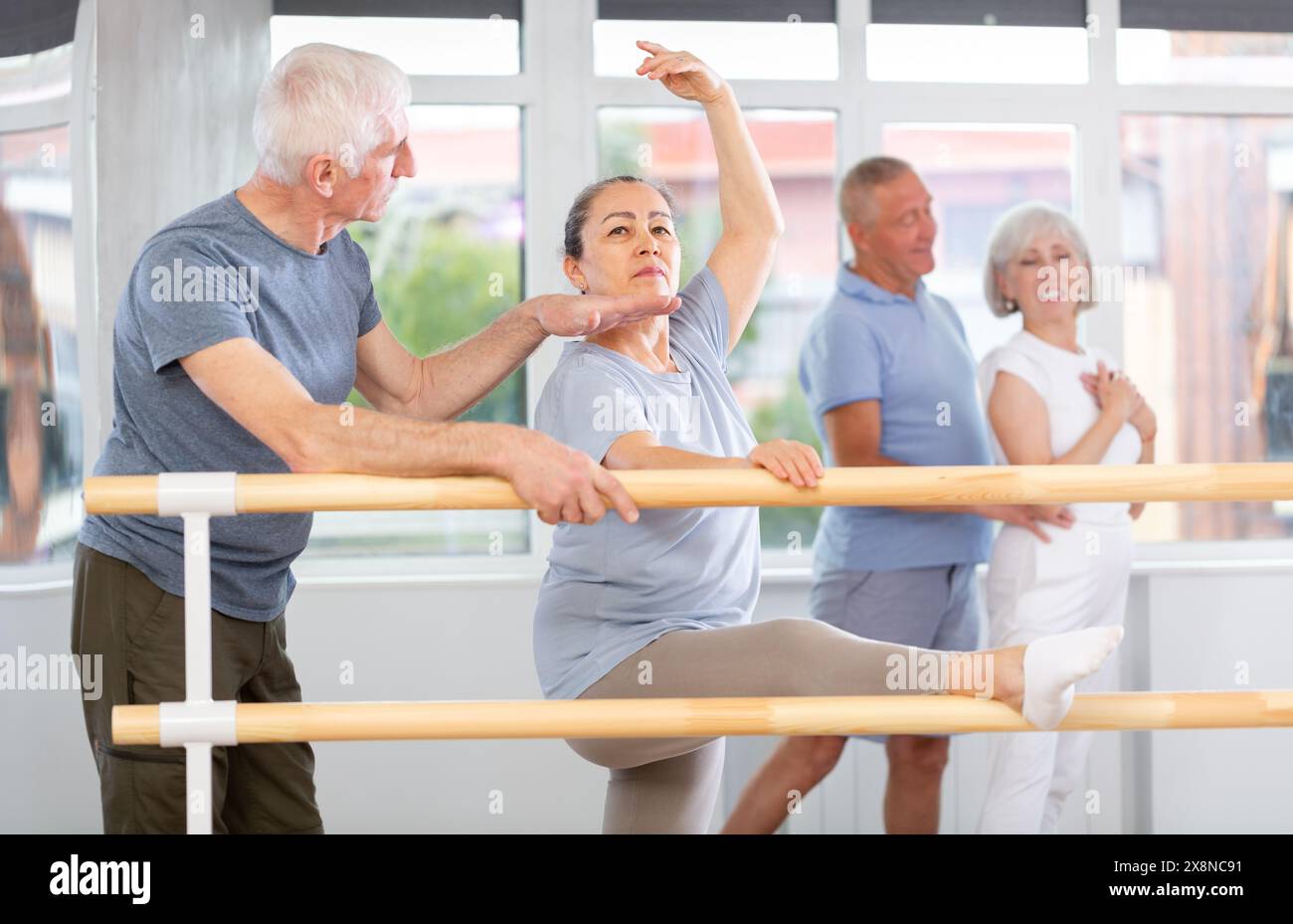 Male choreographer teaches elderly ballet lovers to stand in grand ...