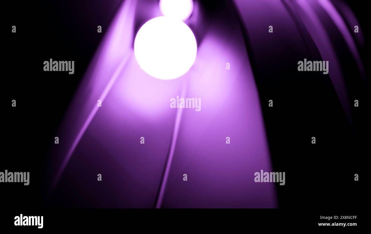 Small light balls rolling among narrow metal track. Design. Shining ...