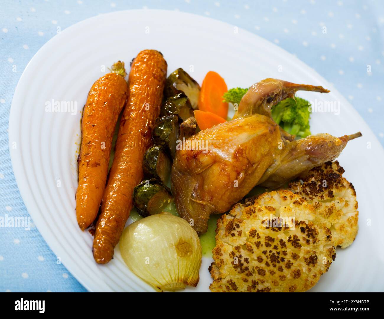 Broiled quail with baked vegetables Stock Photo - Alamy