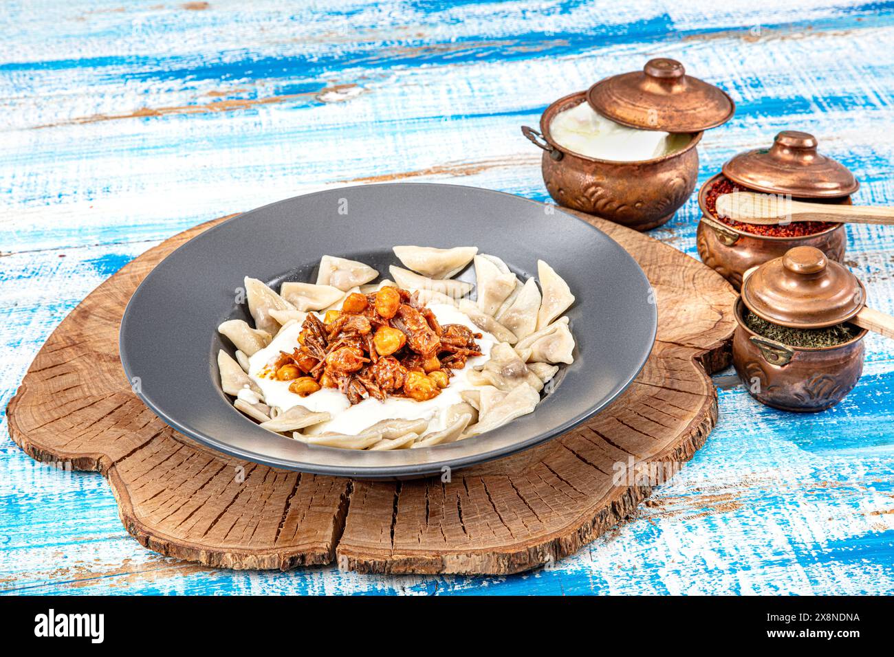Manti is a Turkish food. Ravioli Manti meal on a wood background from ...
