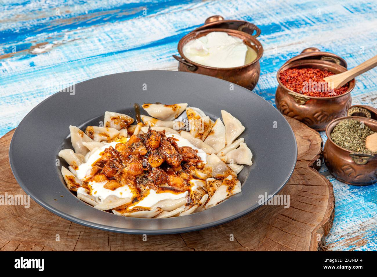 Manti is a Turkish food. Ravioli Manti meal on a wood background from ...