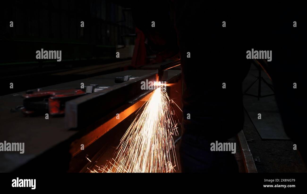 Grinding work with industrial equipment for metal. Clip. Flying sparks ...