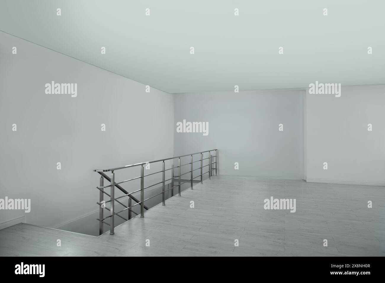 Large empty hall with windows and railings Stock Photo - Alamy