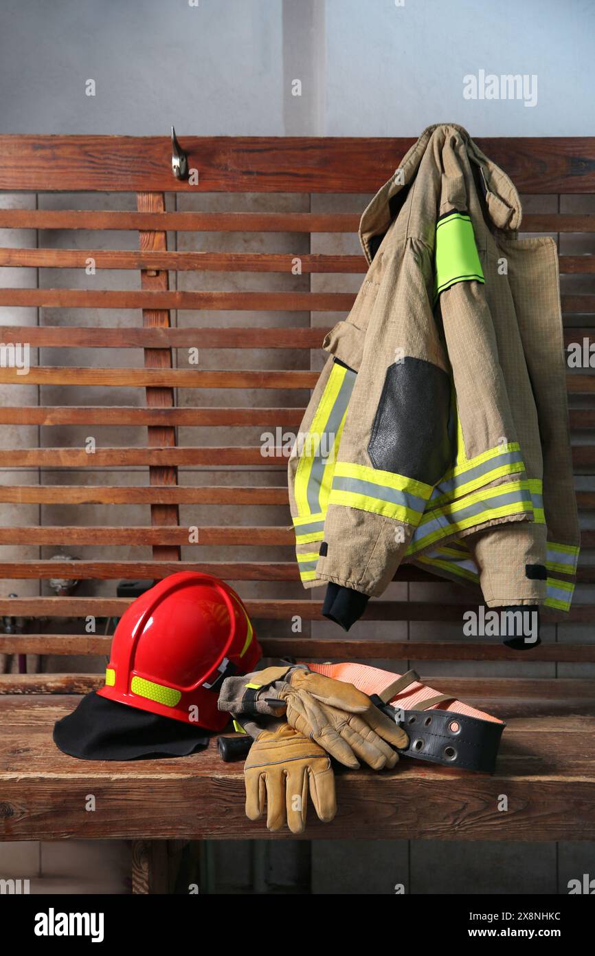 Firefighter`s uniform, helmet, gloves and mask at station Stock Photo ...