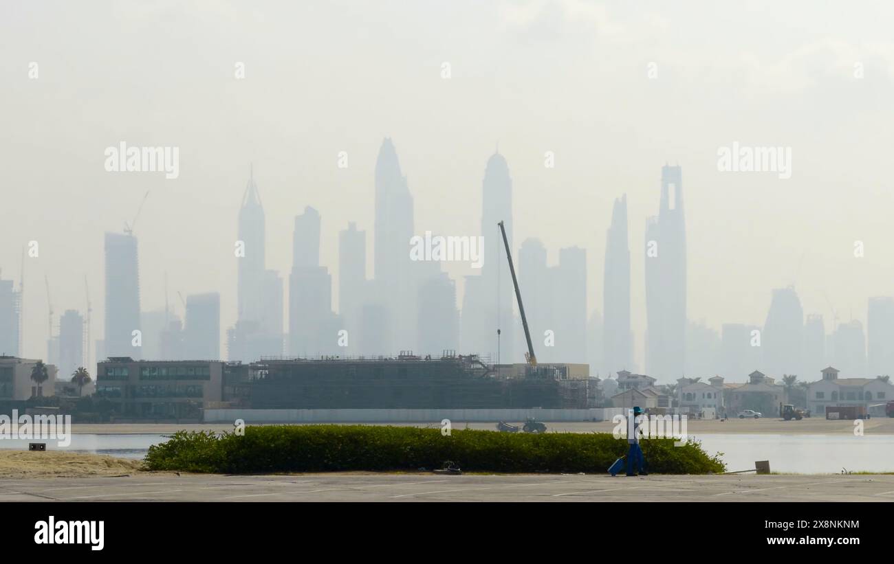 View from the embankment on the city sky scrapers in fog. Action. Tall ...