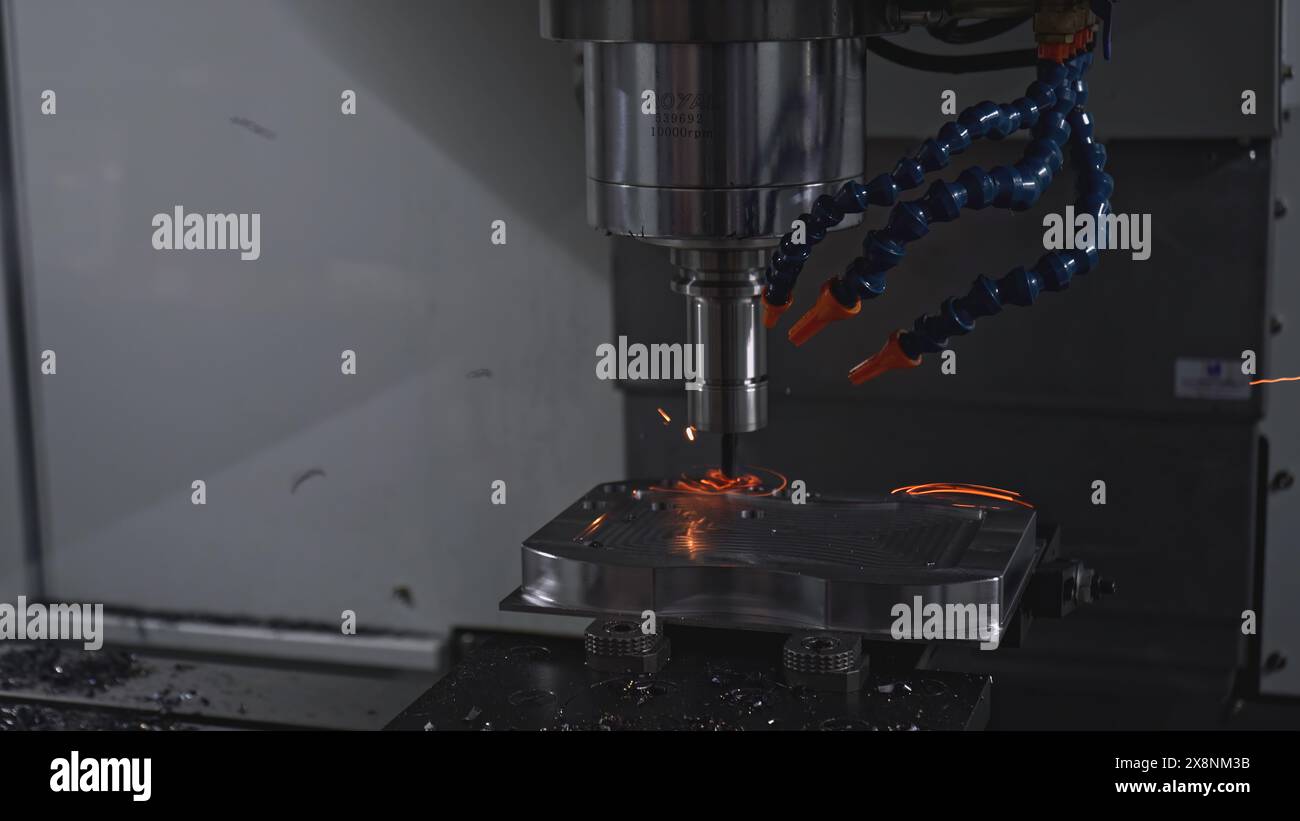 Automated rotating drill for metal. Media. Machine with drill moving in ...